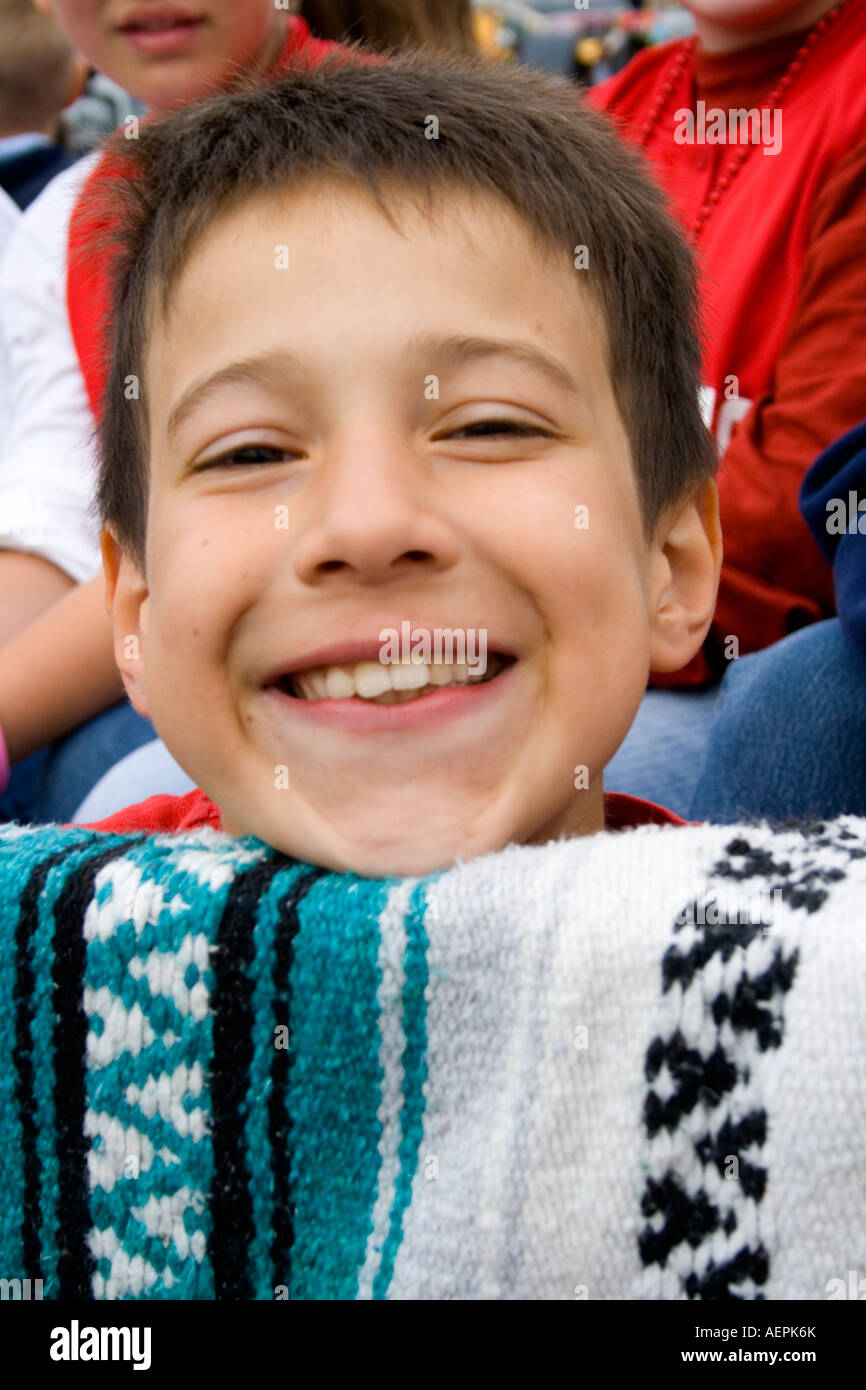 Happy boy age 11 holding up is serape. Cinco de Mayo Fiesta. "St Paul ...