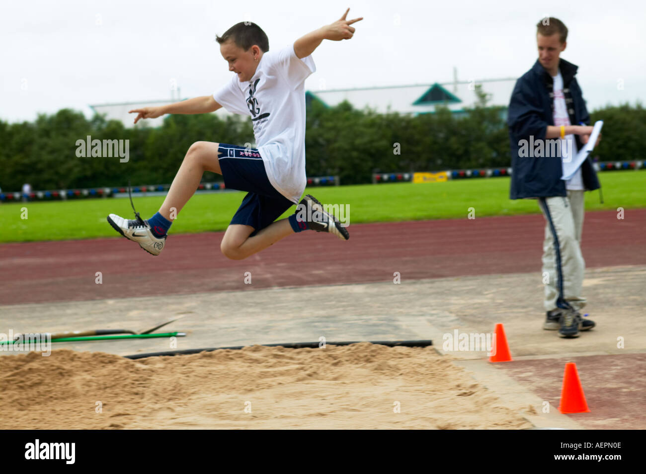 Teen competing in long jump hi-res stock photography and images - Alamy