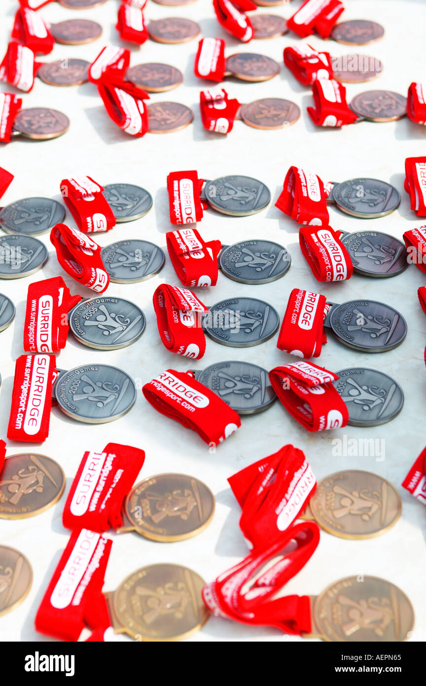 medals and trophies on prize table at sporting event Stock Photo - Alamy