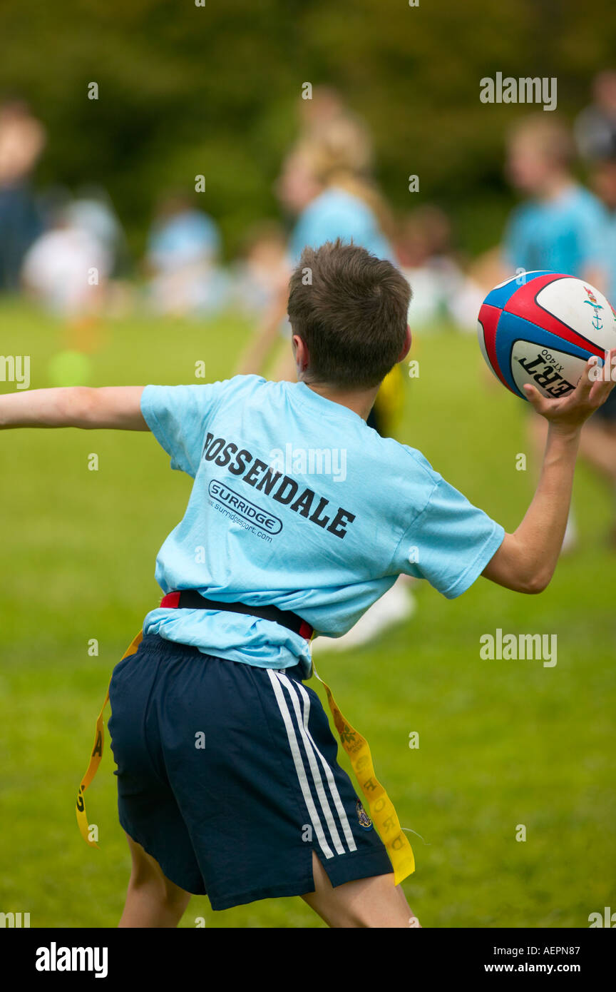 young boy playing rugby football at sports day event Stock Photo - Alamy