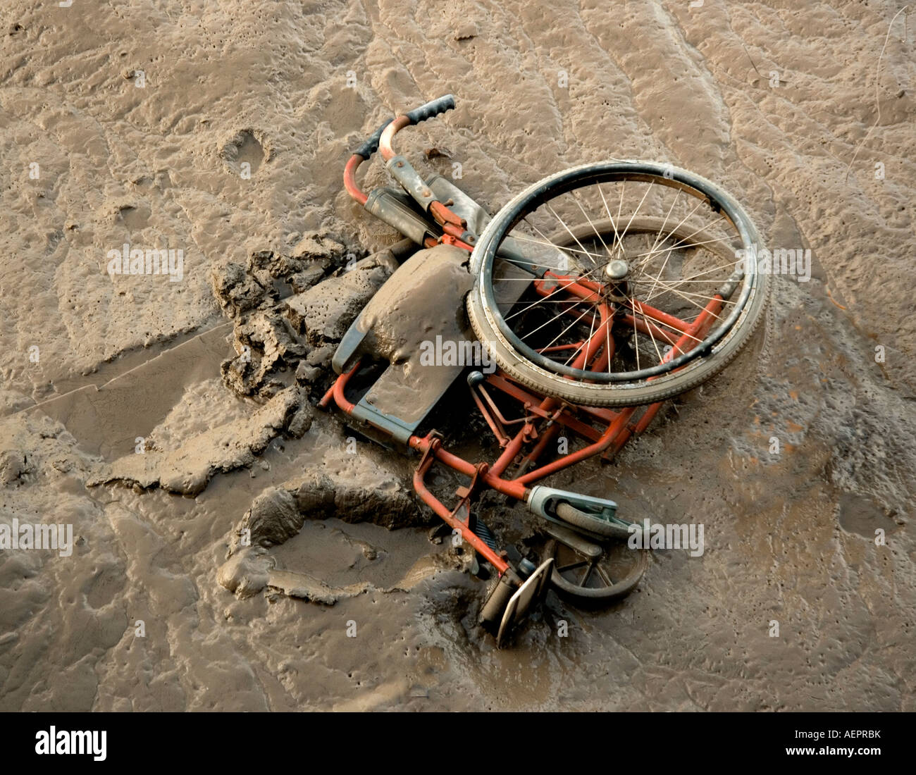 Wheelchair in the mud hi-res stock photography and images - Alamy
