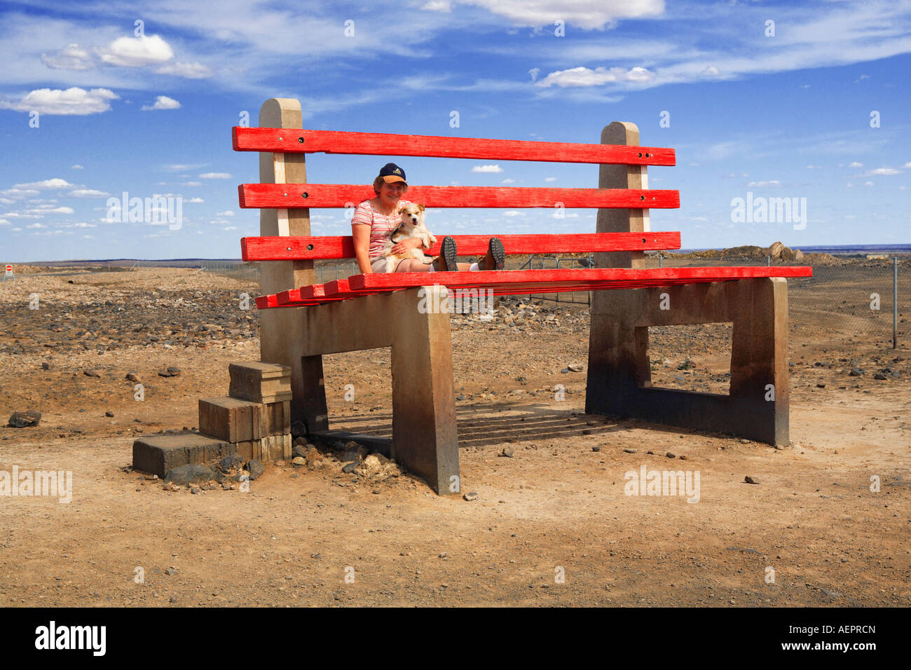 Large red Park Bench, woman nursing pet dog, Line of Lode lookout ...