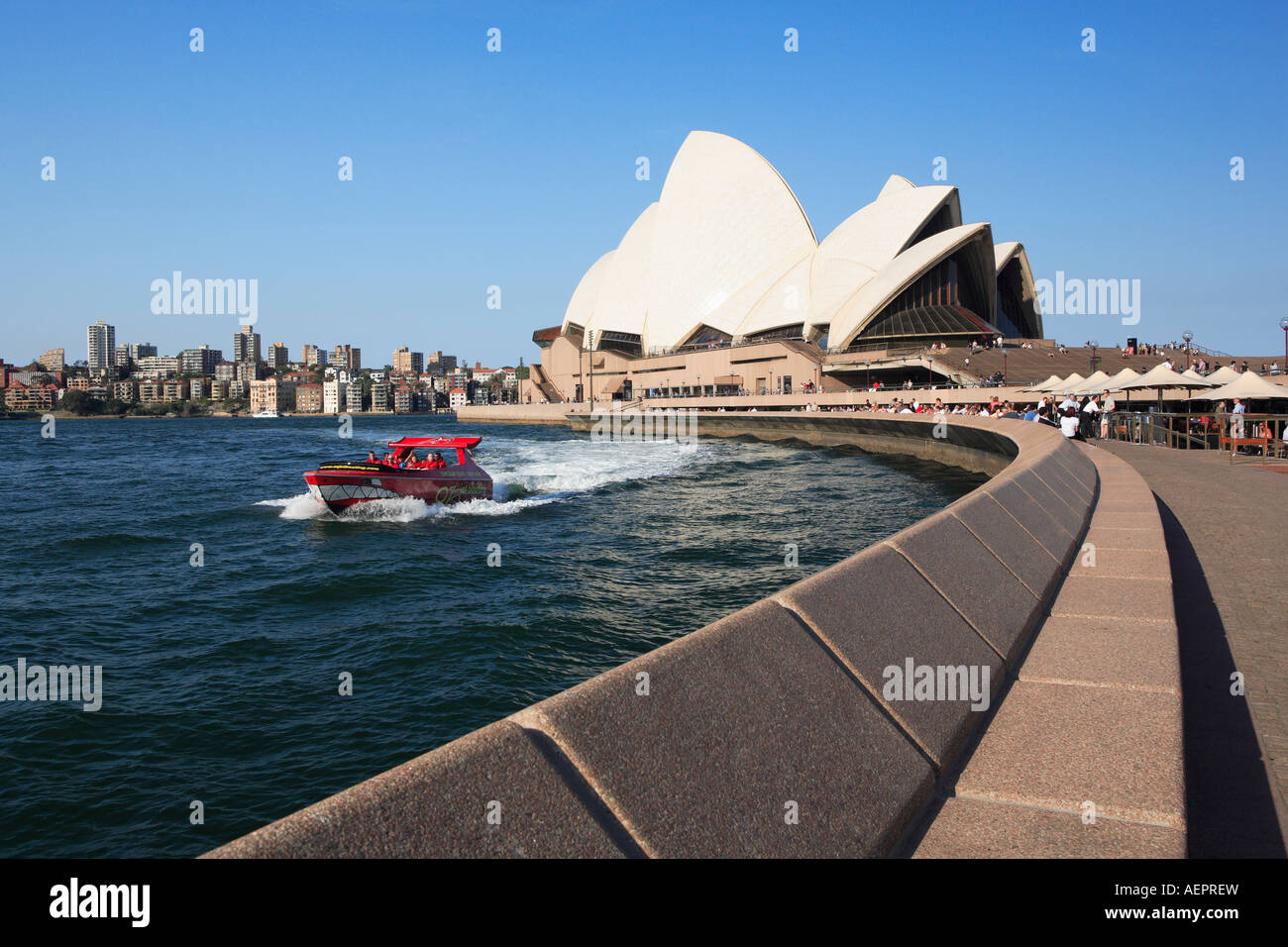 Opera House promenade, red speed boat, Bennelong Point, Sydney ...