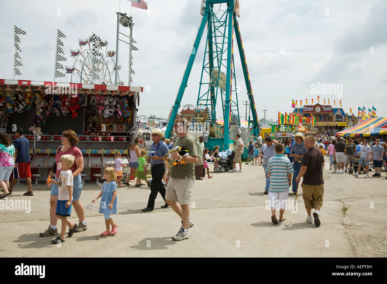 ILLINOIS Grayslake People walk past amusement rides and arcade games at ...