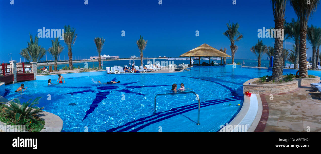 Abu Dhabi UAE Hilton Resort People In Swimming Pool Stock Photo - Alamy