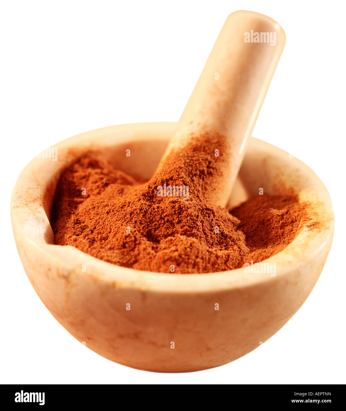 GROUND CINNAMON IN PESTLE AND MORTAR CUT OUT Stock Photo - Alamy