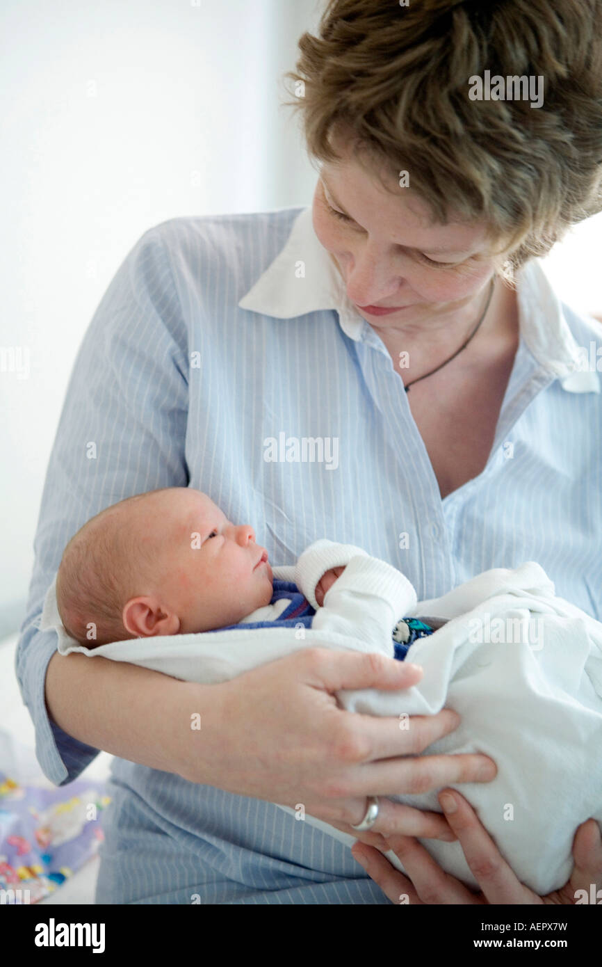 mother with an infant in her arms Stock Photo - Alamy