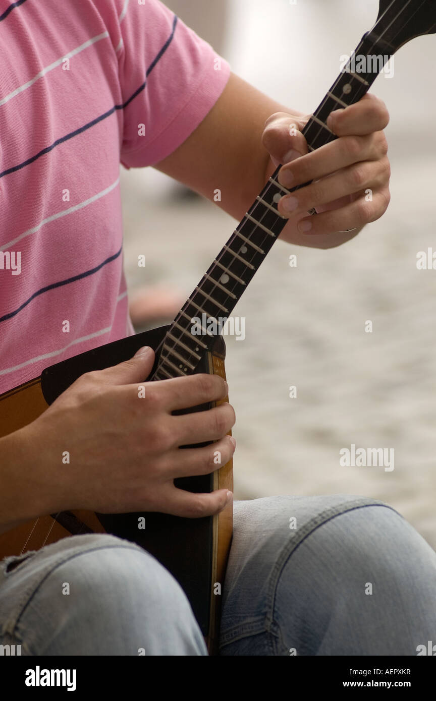 A musician play with an old string instrument Stock Photo - Alamy