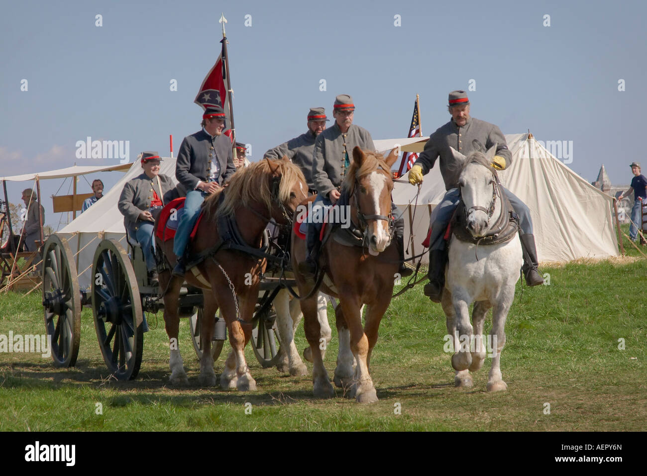 A wagon and horses driven and ridden by Confederate soldier reenactors ...