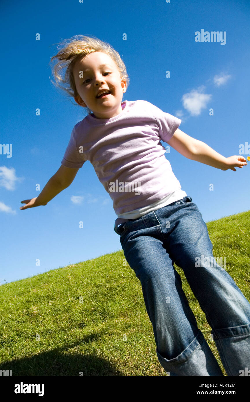 Child jumping hands air hi-res stock photography and images - Alamy