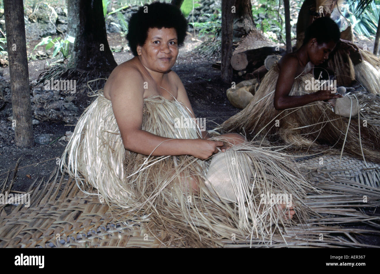 Woman weaving baskets Ekasup Cultural Village Efate Island Vanuatu ...
