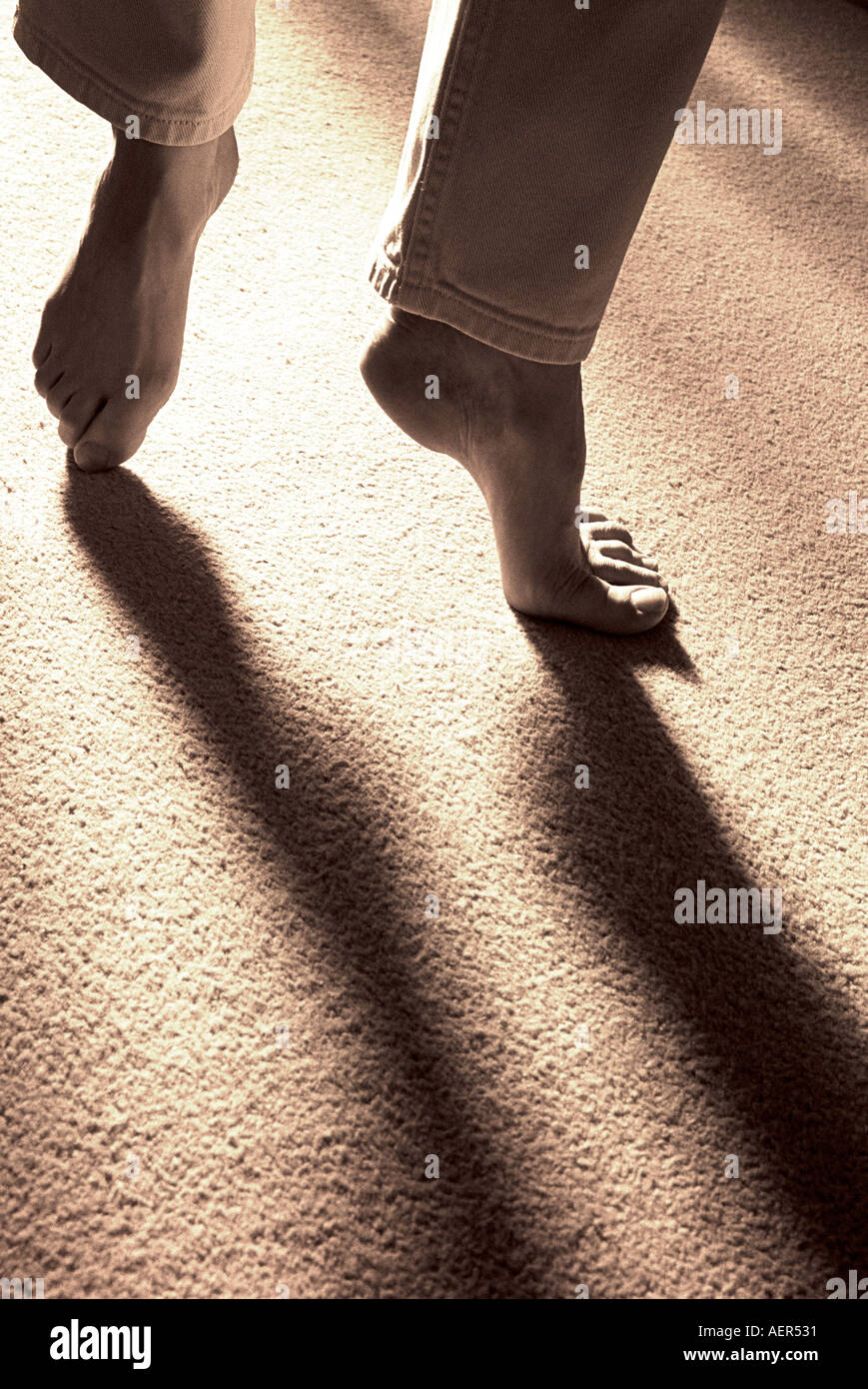 Adult moving carefully forward on tips of toes Stock Photo - Alamy