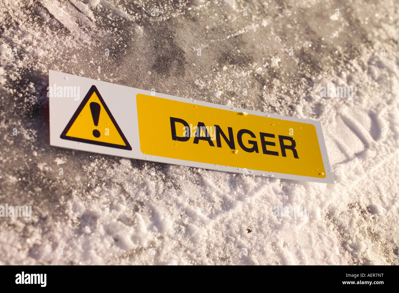 danger sign on ice Stock Photo - Alamy