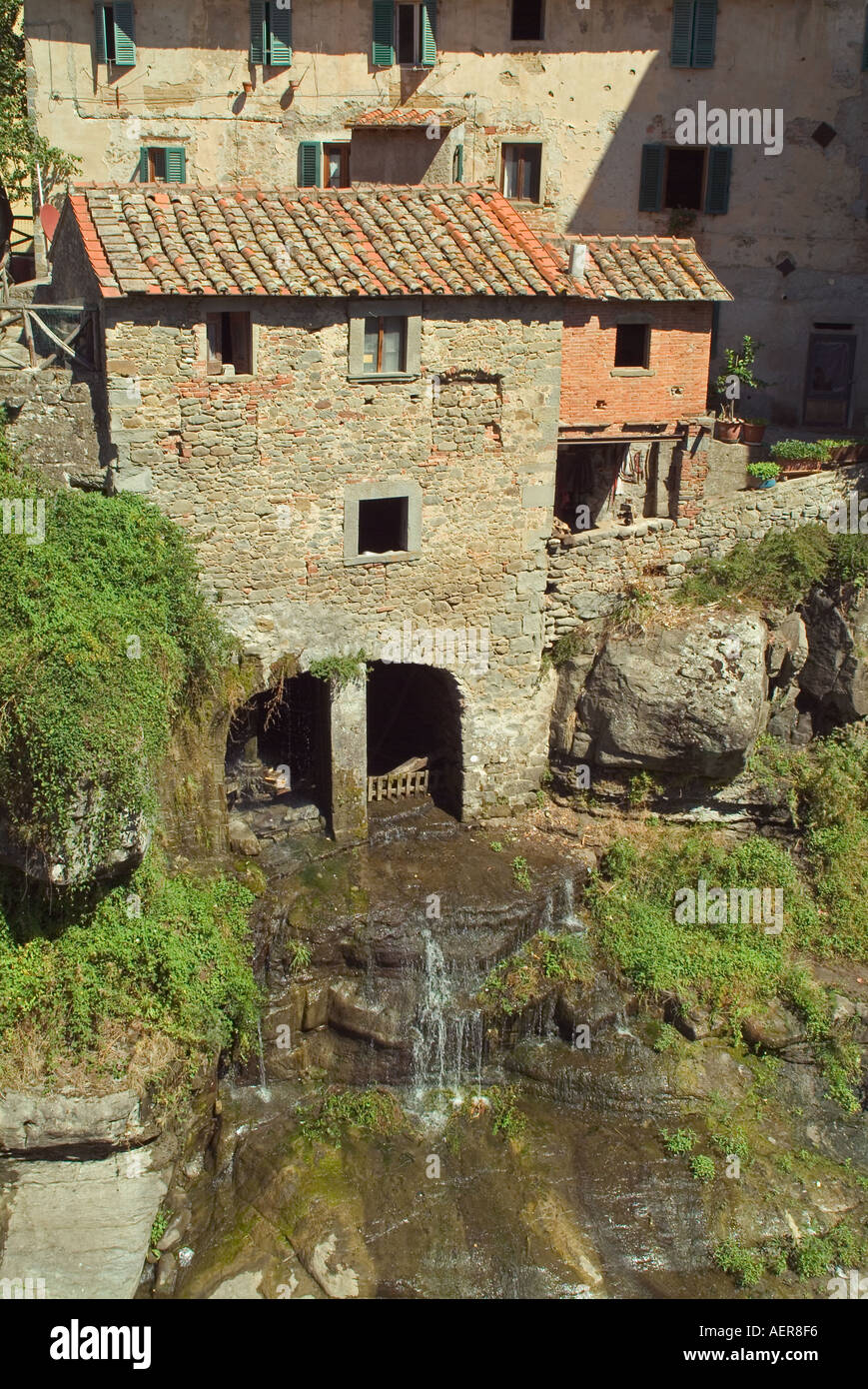 Tuscany Italy Ancient water mill Looking up at buildings in the ...