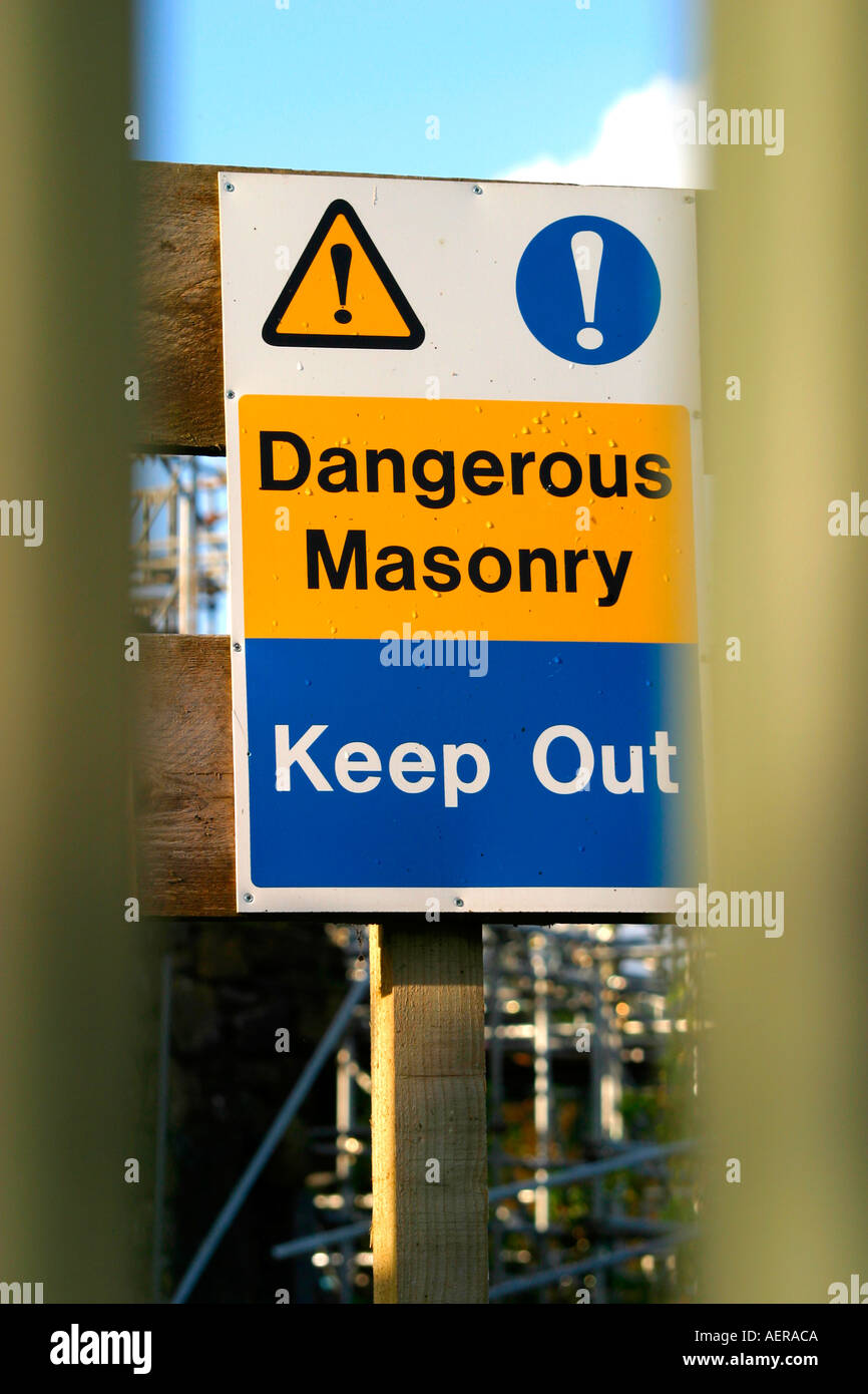 Dangerous masonry sign on building site Stock Photo - Alamy