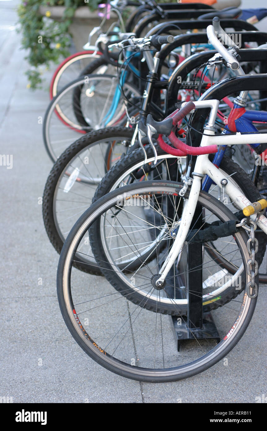 Bikes chained to a rack Stock Photo - Alamy