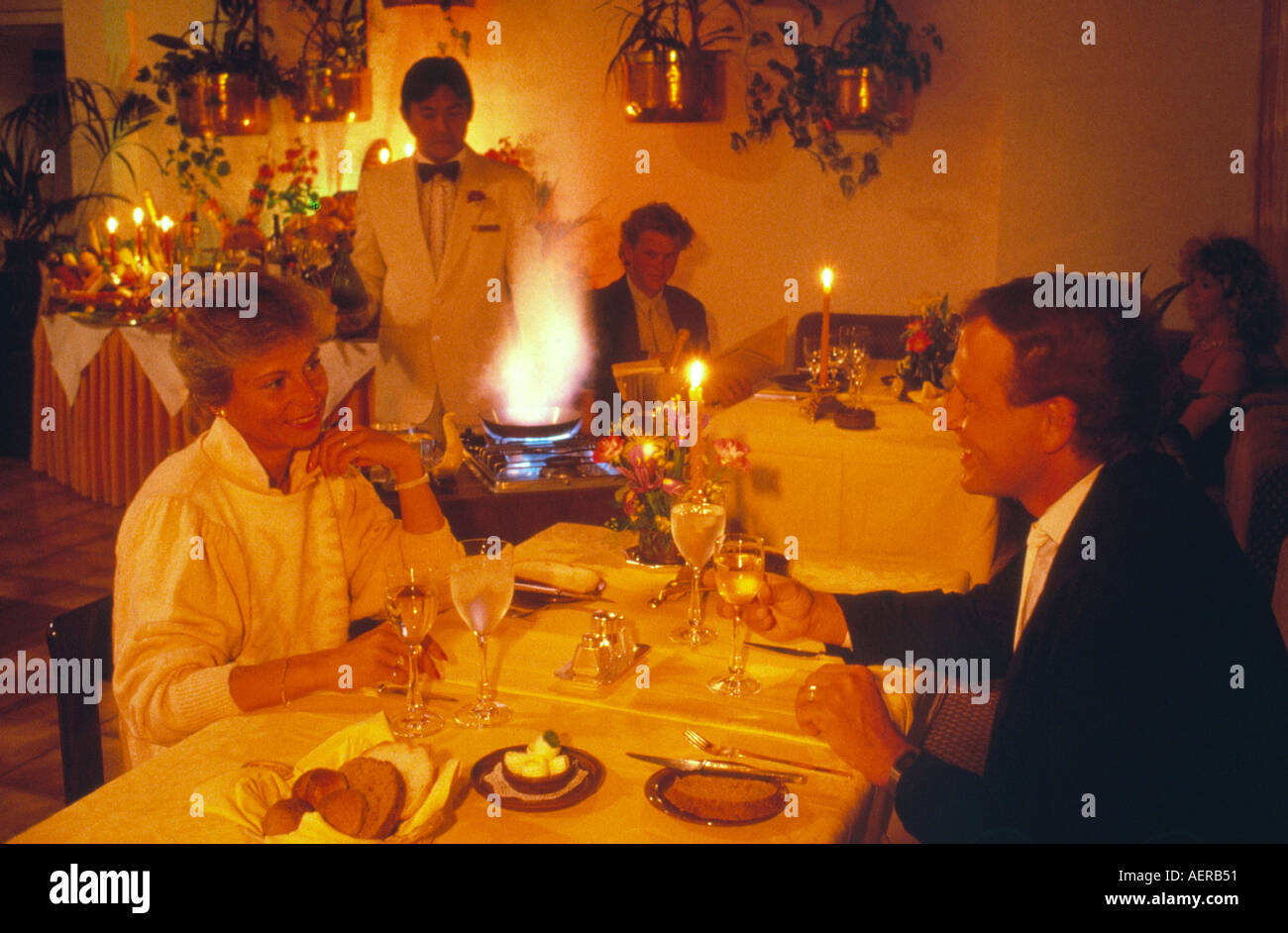 couple at sophisticated dinner at dining room Stock Photo - Alamy