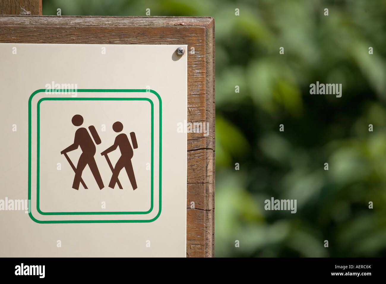 touring sign with blurred forest background Stock Photo - Alamy