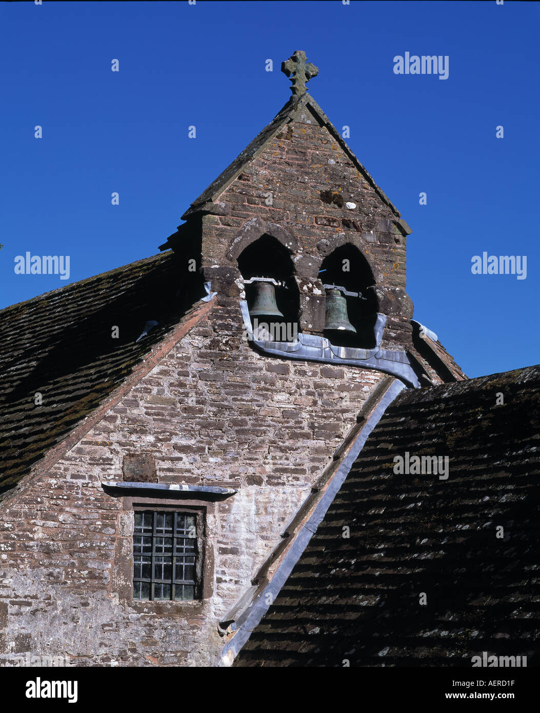 Twin bell tower of an ancient Welsh church in the hills near ...