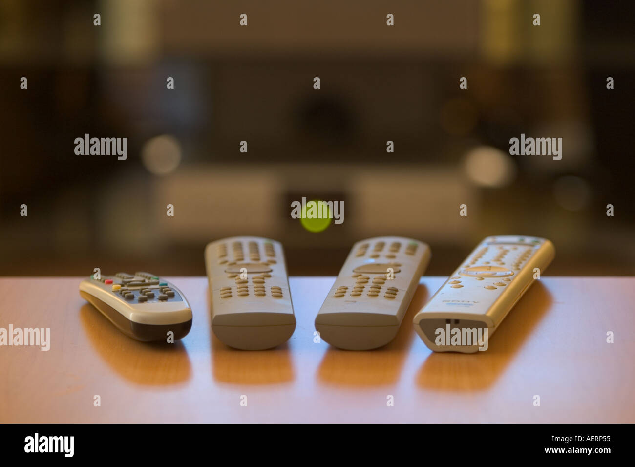 four silver grey remote control devices Stock Photo - Alamy