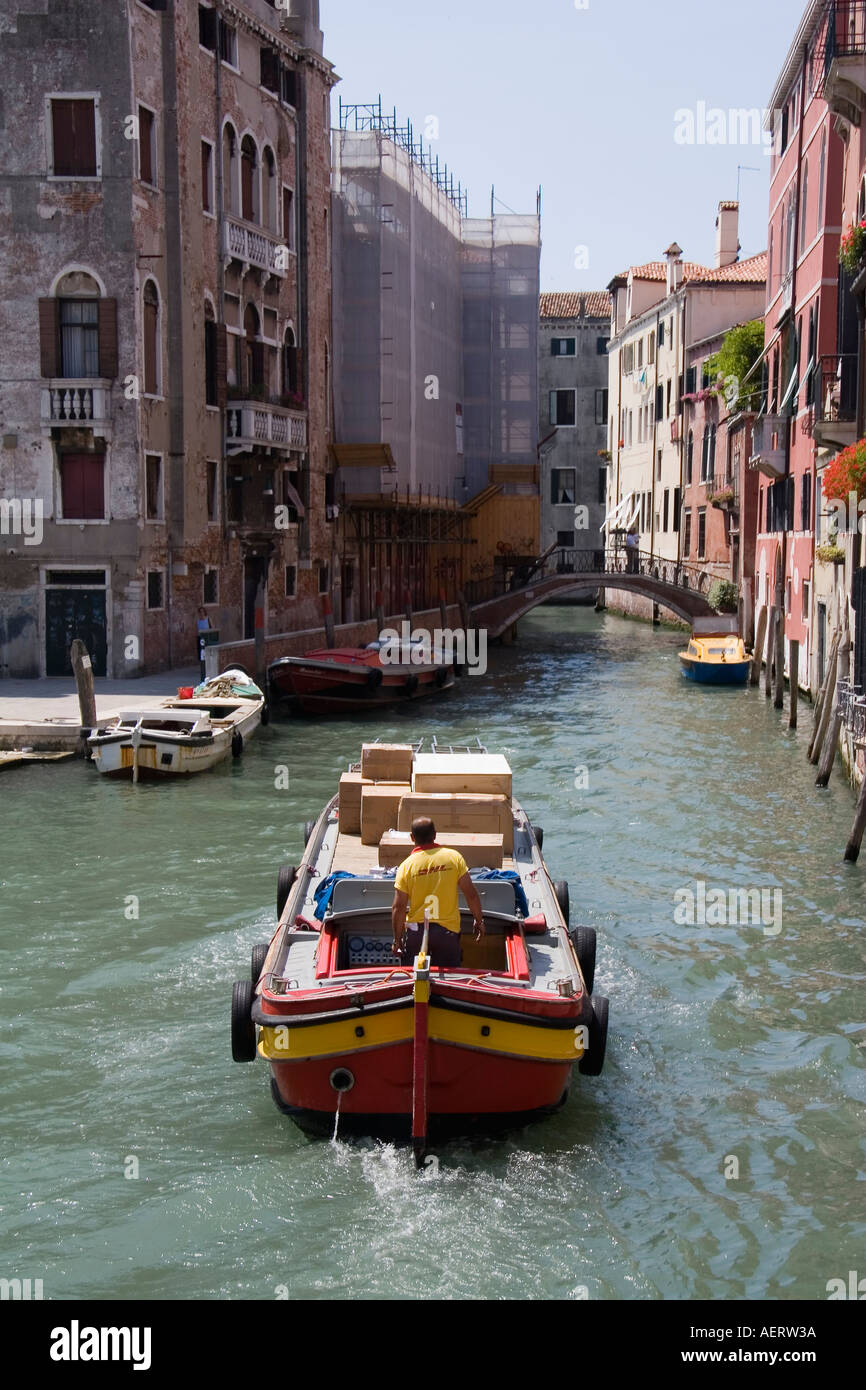 DHL boat motors up the Rio dei Mendicanti Venice Italy Stock Photo - Alamy