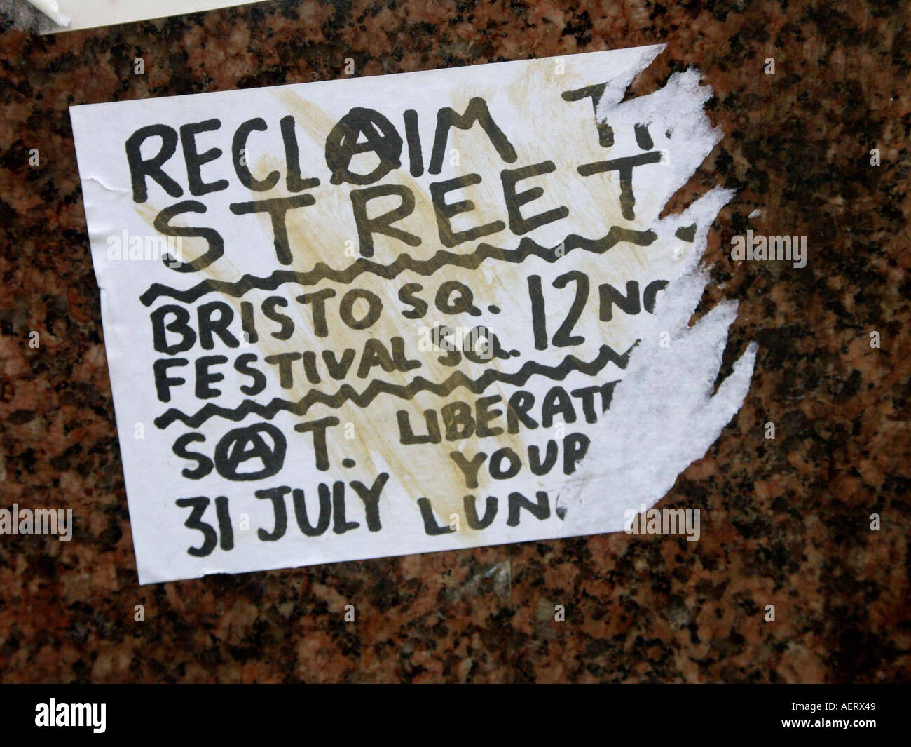 old reclaim the street sticker half ripped of a wall in edinburgh ...