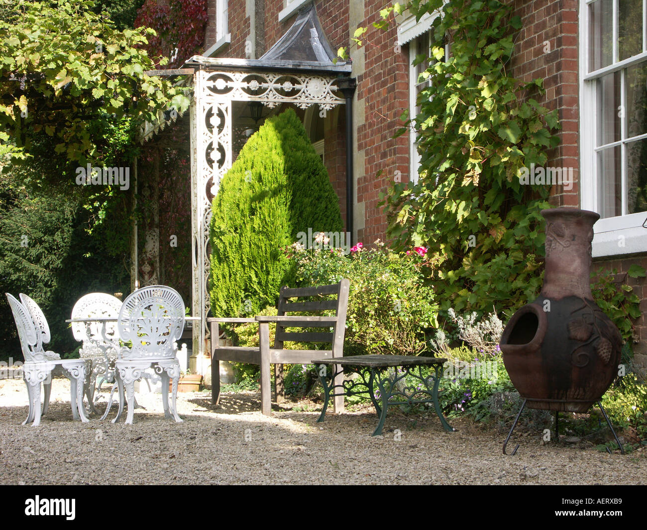 an array of seating outside the back of an english country estate on ...