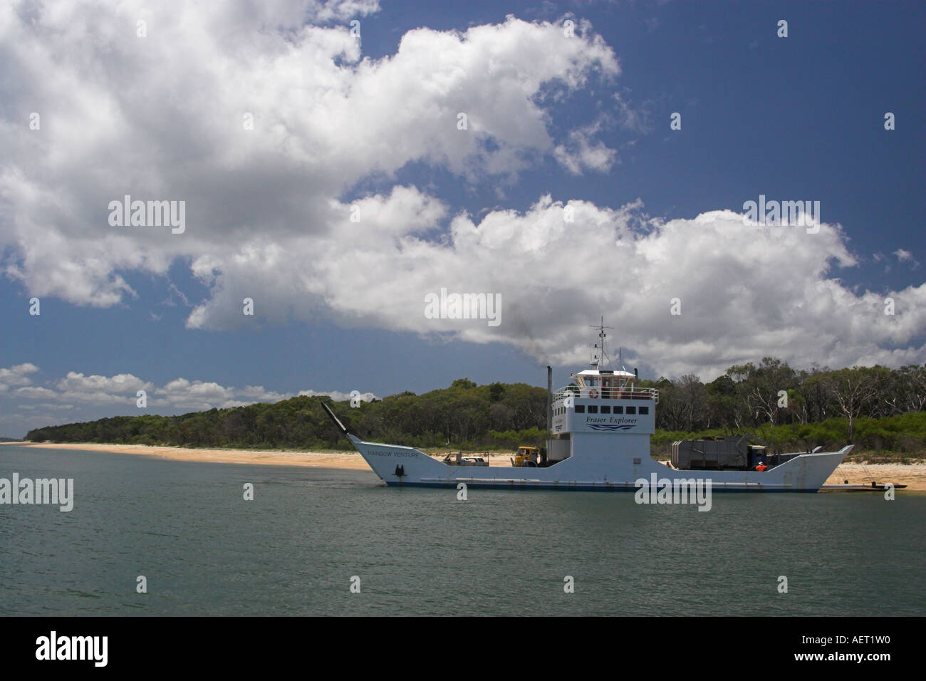 A barge from the mainland crosses from Inskip Point near Rainbow Beach ...