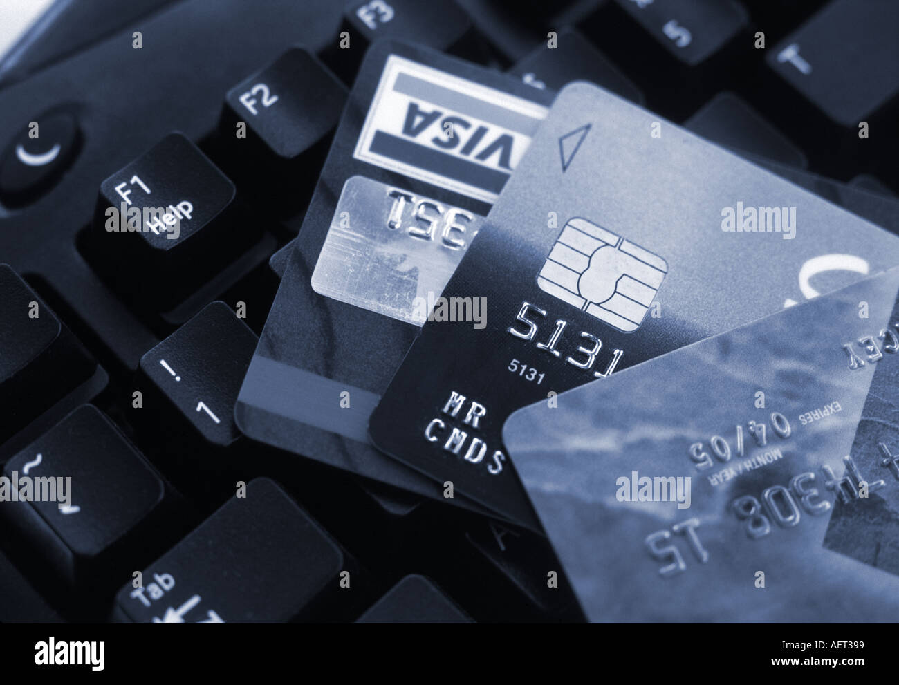 computer keyboard showing help button with credit and debit cards in ...