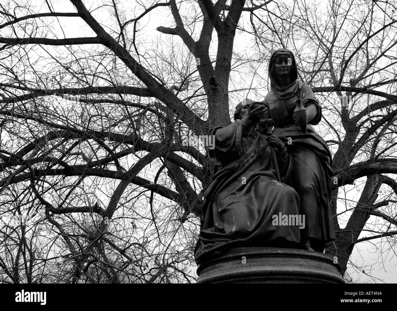 A statue of a woman giving a man water, at a water fountain in Clapham ...