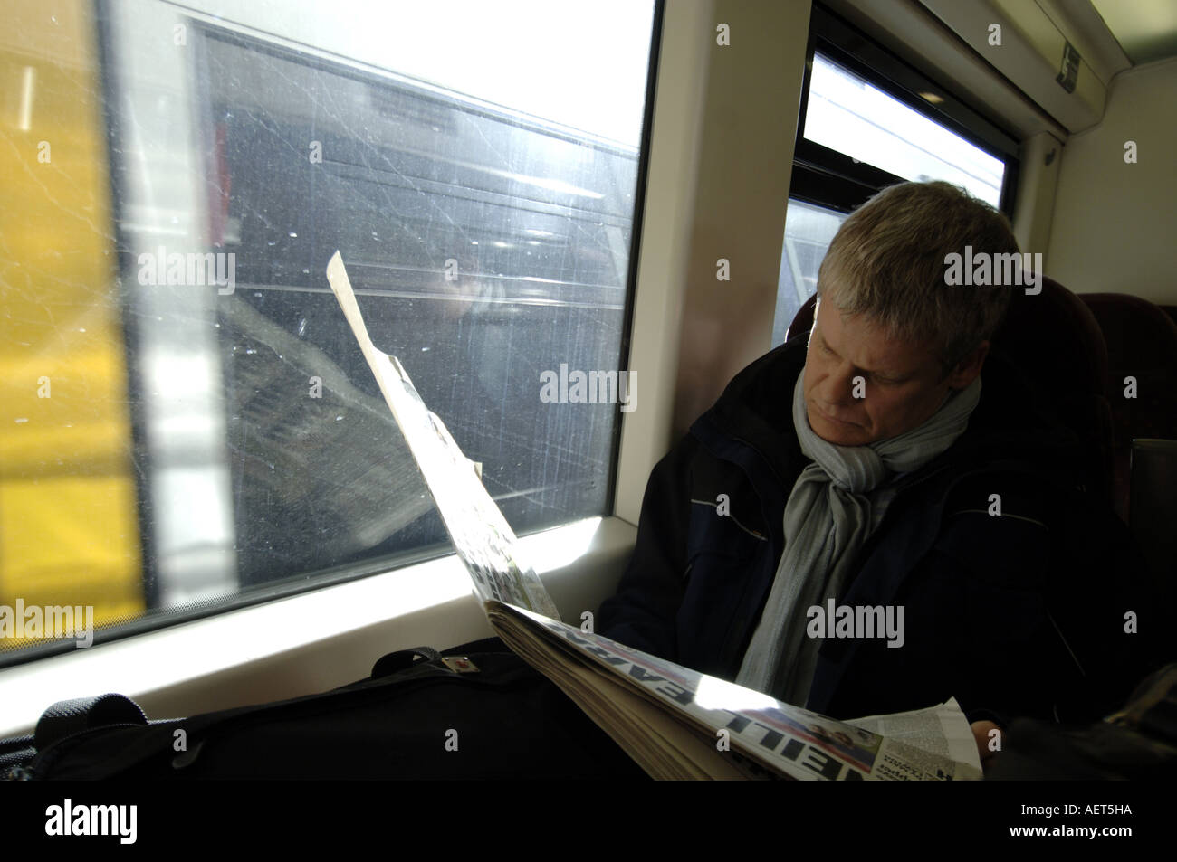 A train commuter with his newspaper in London, UK Stock Photo - Alamy