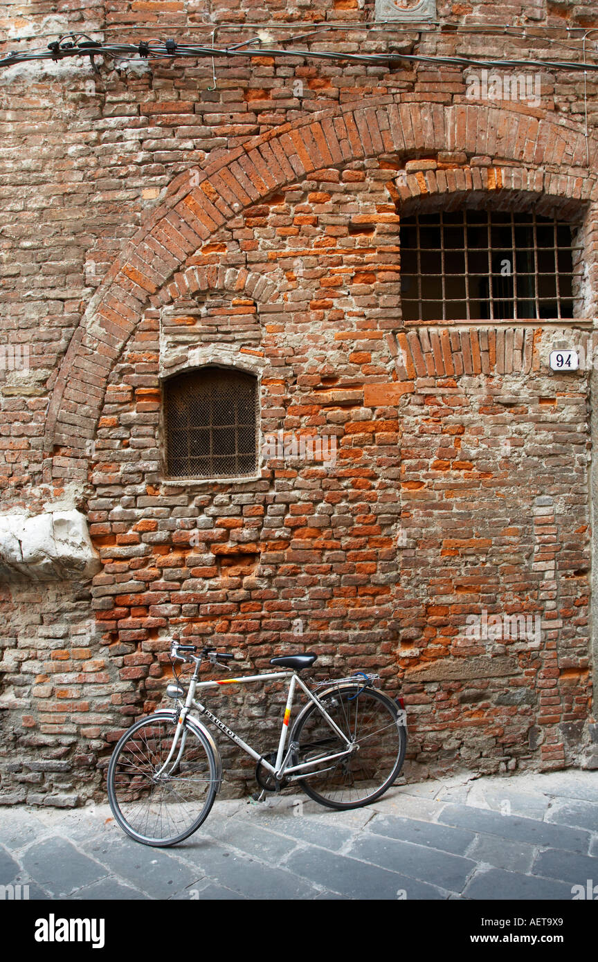 Red Brick Wall Old Arch and Bicycle Lucca Tuscany Italy Stock Photo - Alamy
