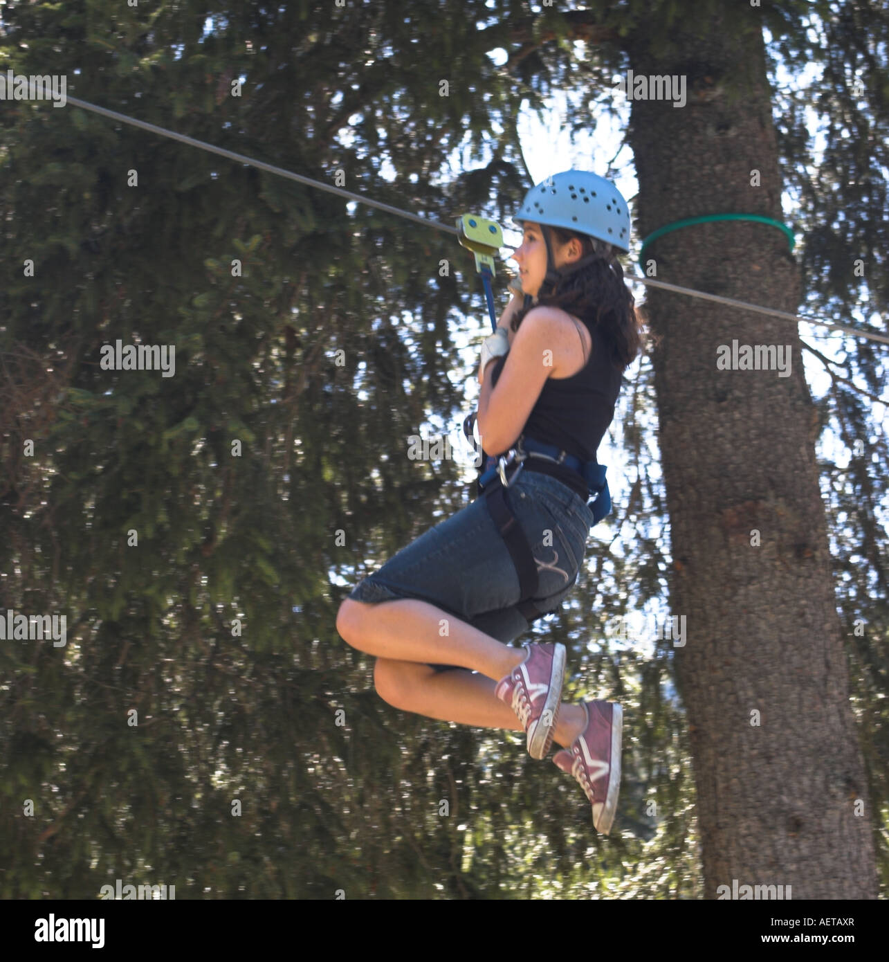 Girl on zip wire Stock Photo - Alamy