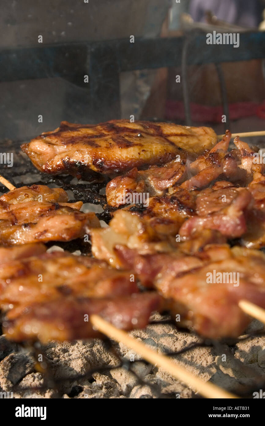Sate sticks grilling over a street barbecue Bangkok Stock Photo - Alamy