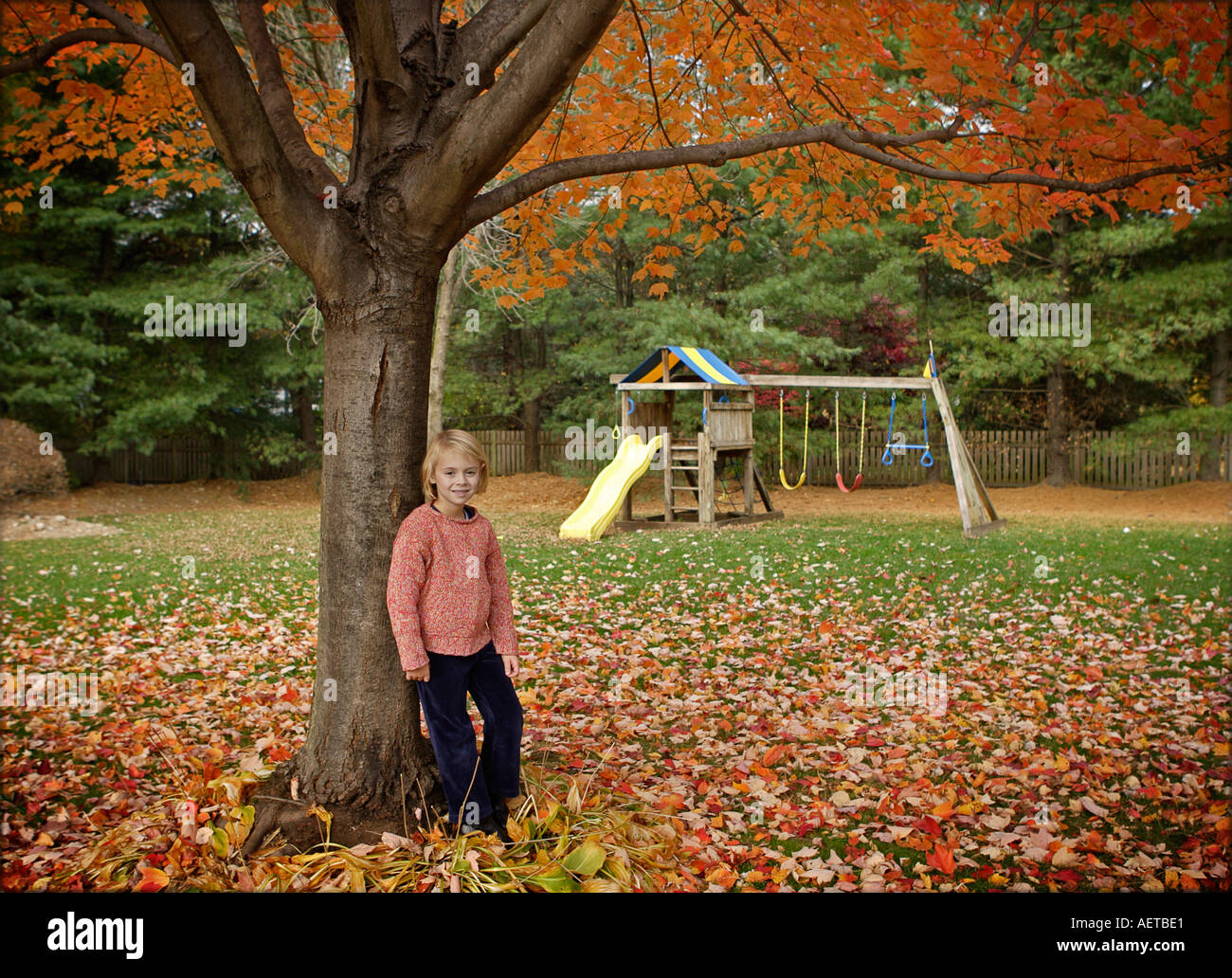 Child standing alone in playground hi-res stock photography and images ...