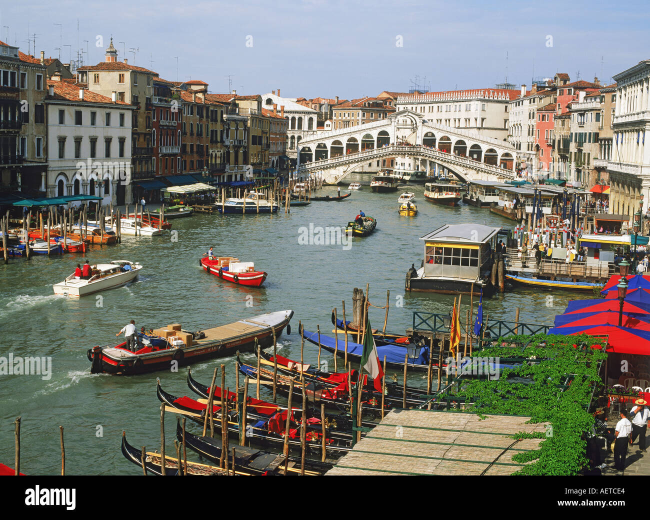 Boat traffic on Grand Canal with Rialto Bridge in Venice Stock Photo ...