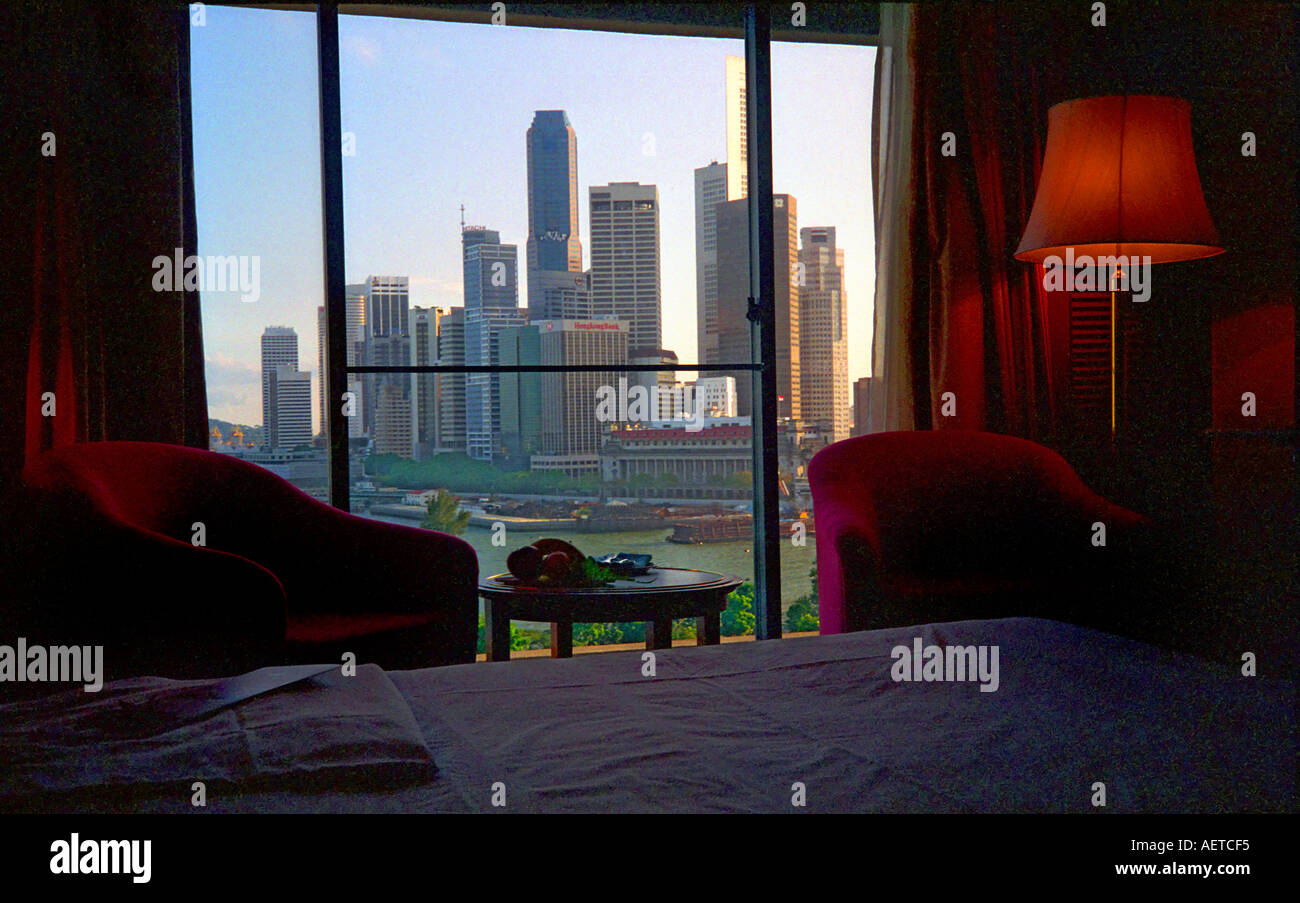 Hotel bedroom singapore city in window Stock Photo - Alamy