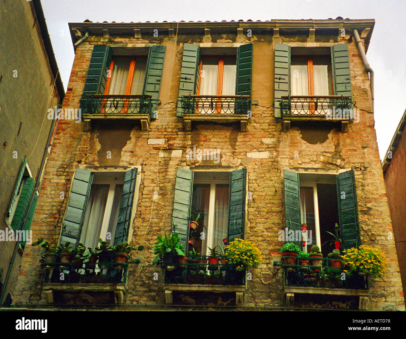 Venetian house facade with green shutters and flowerboxes venice italy ...