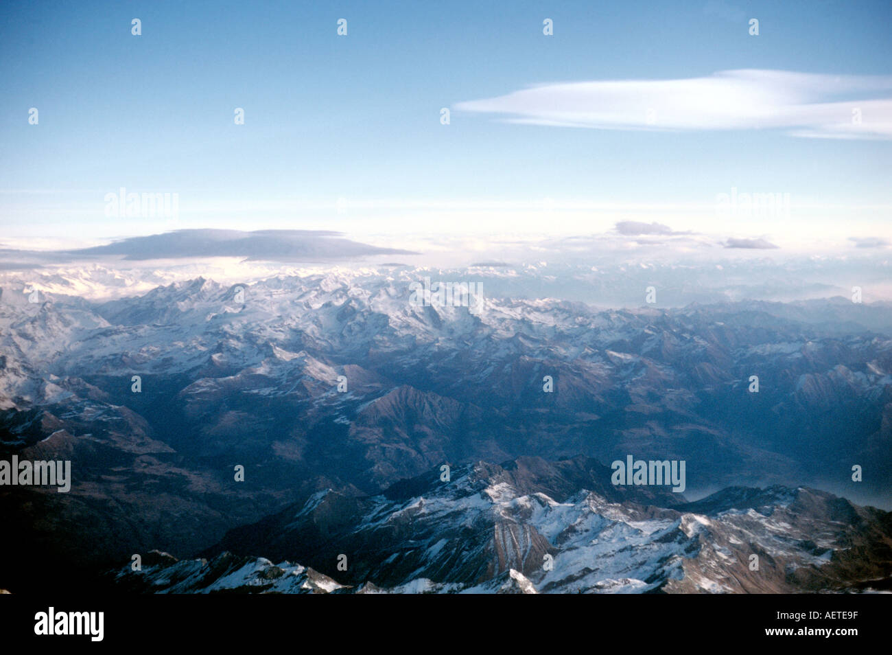 Aerial view of the Alps seen through window of passenger plane Stock ...