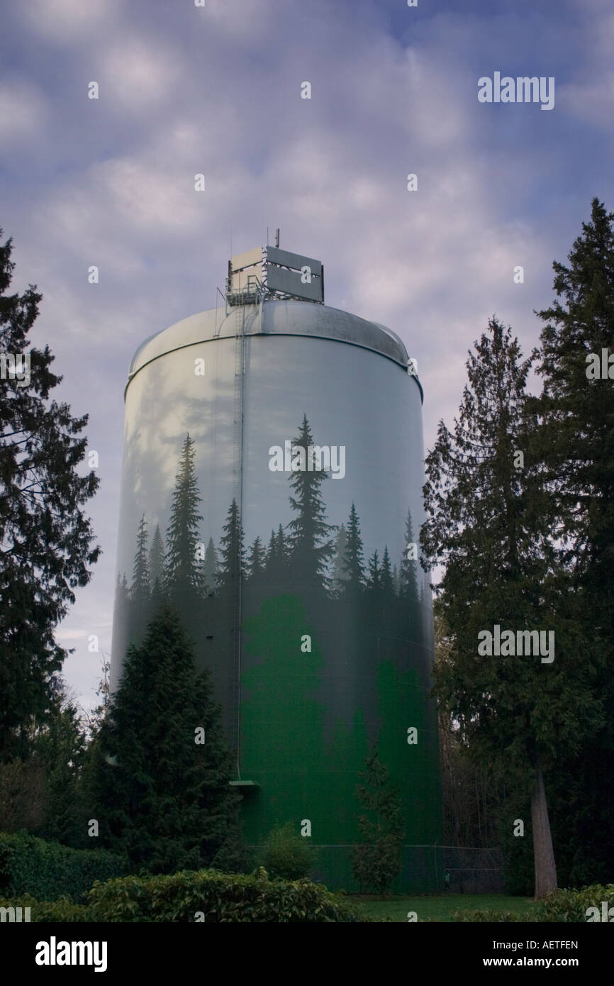 Water tower with painted evergreen trees Stock Photo - Alamy