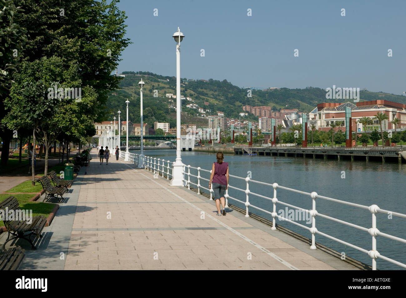 People walking along riverside, Bilbao Stock Photo - Alamy