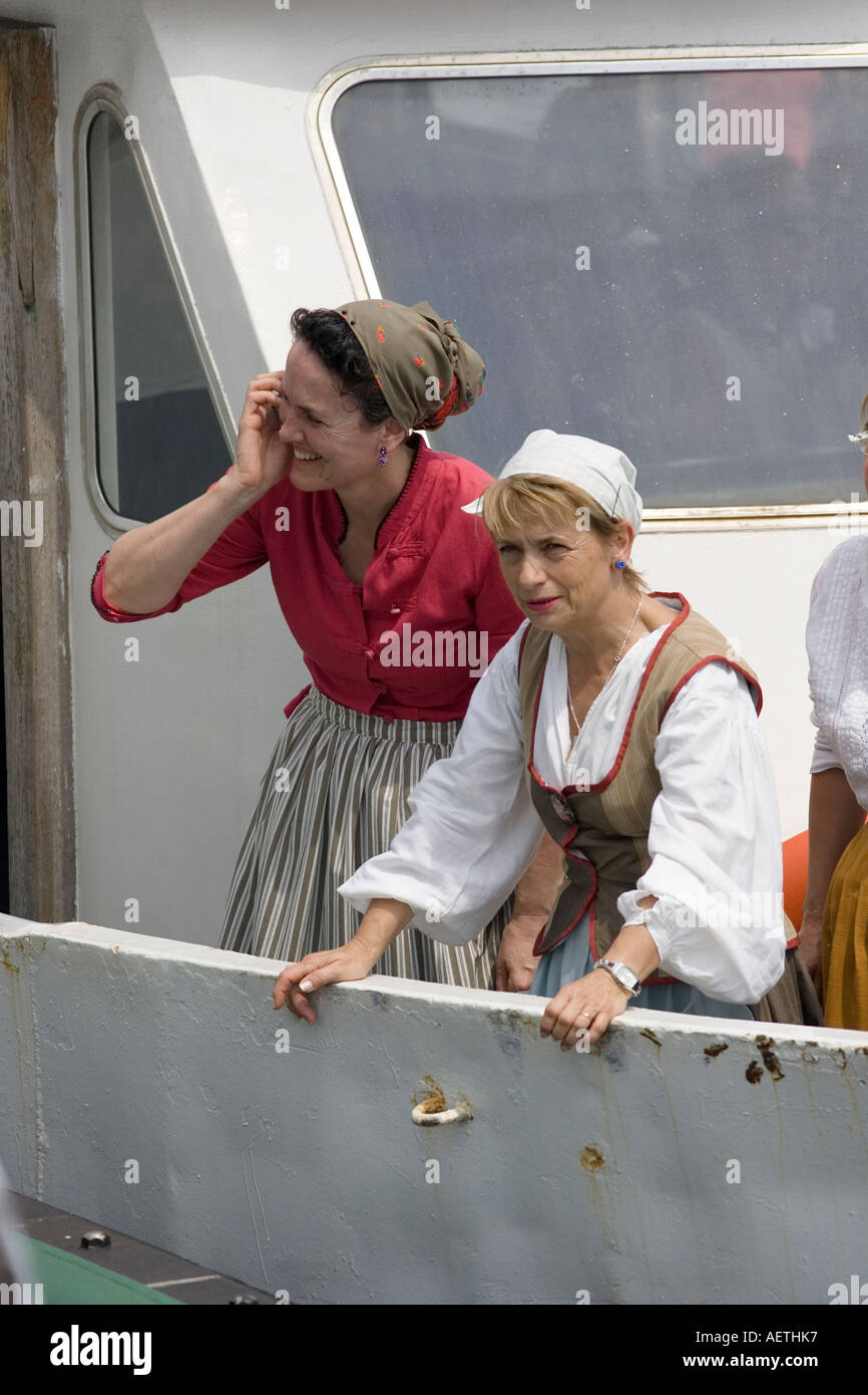 Two Basque women in traditional dress on boat during Virgen de la Guia ...