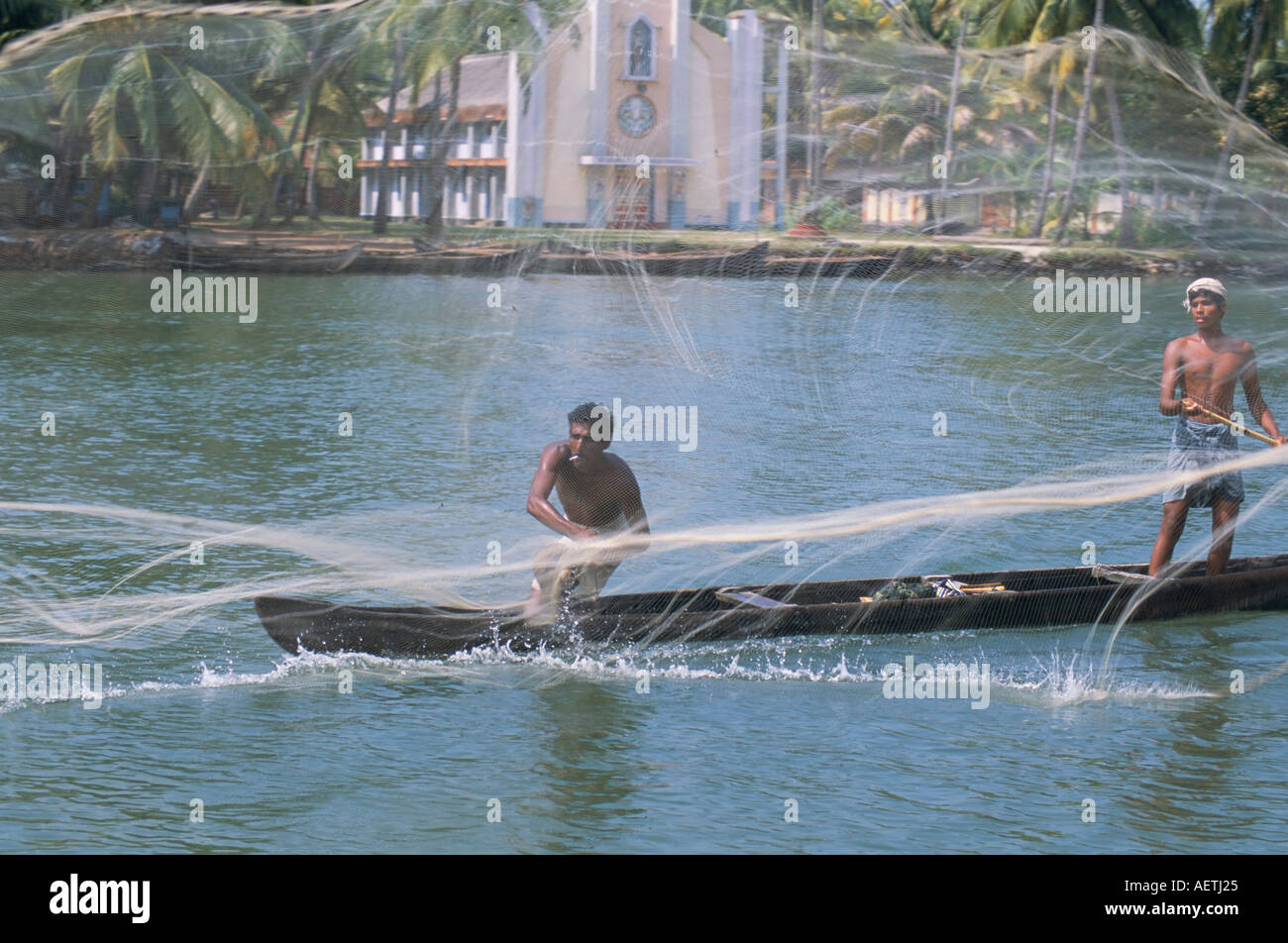 Fisherman casting his throw net in the coastal backwaters Kerala India ...