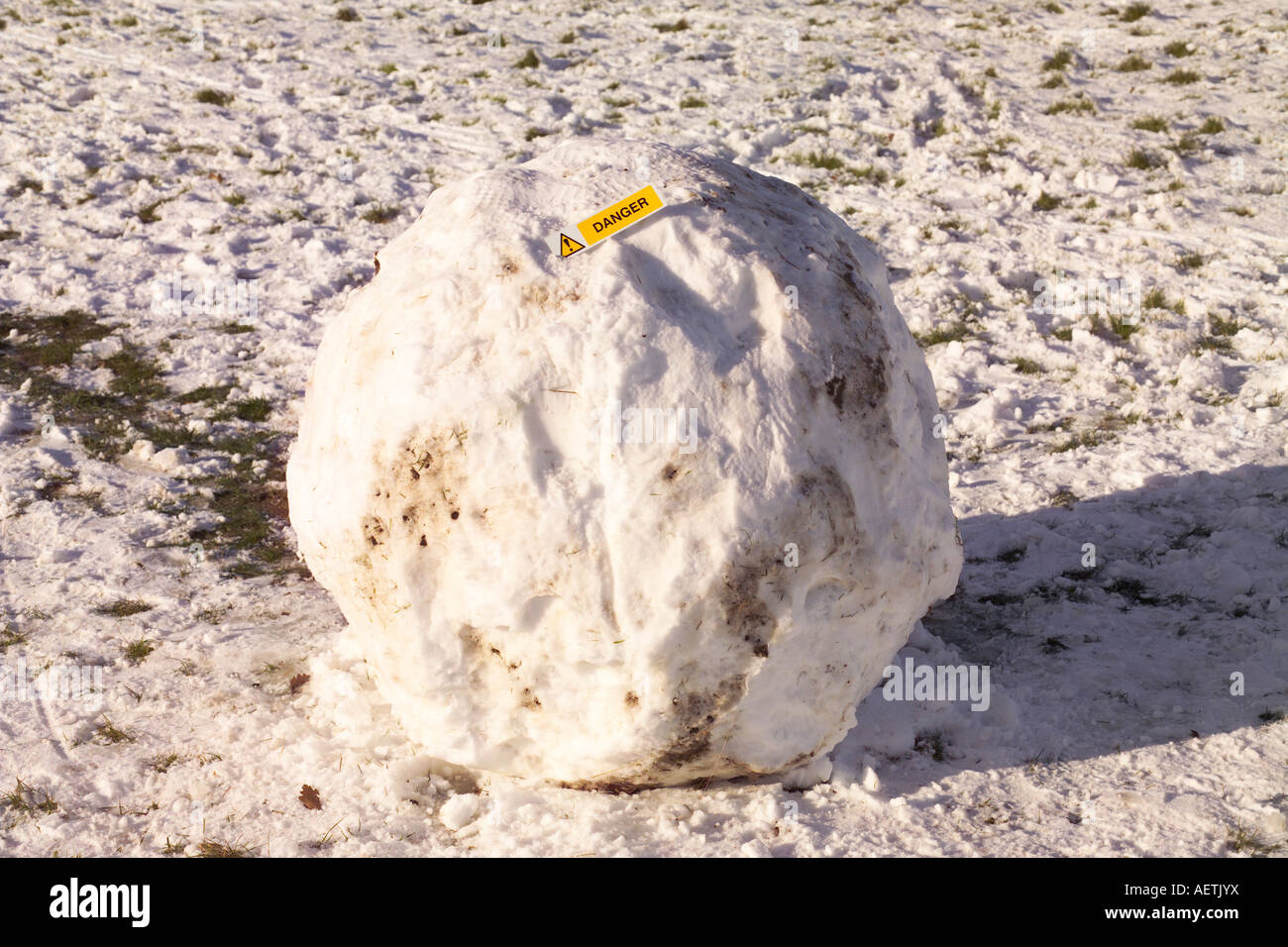 huge snowball with danger sign Stock Photo - Alamy