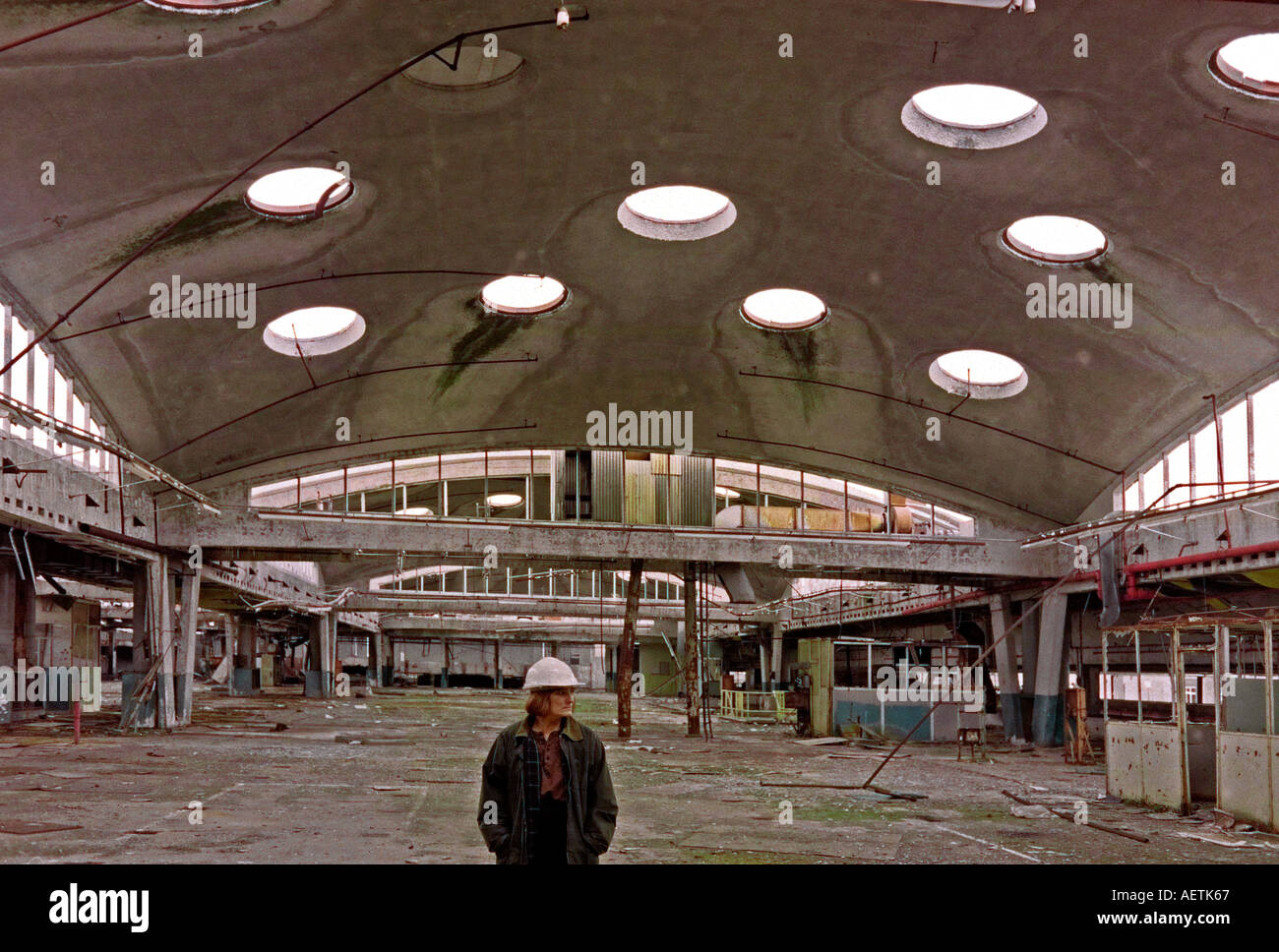 Interior Brynmawr Rubber Factory with female figure Stock Photo - Alamy