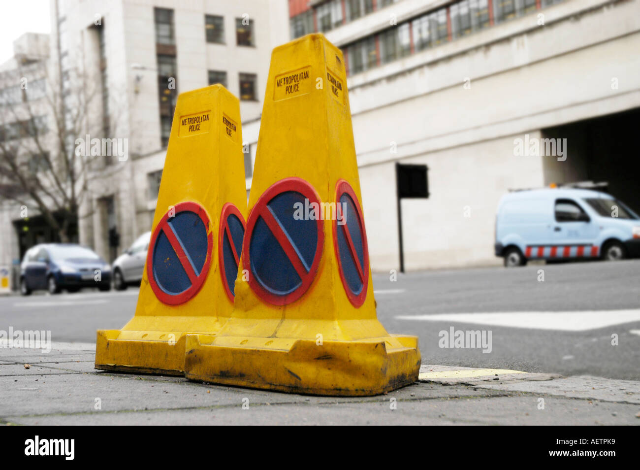 Police yellow no waiting cones on a London street Stock Photo - Alamy