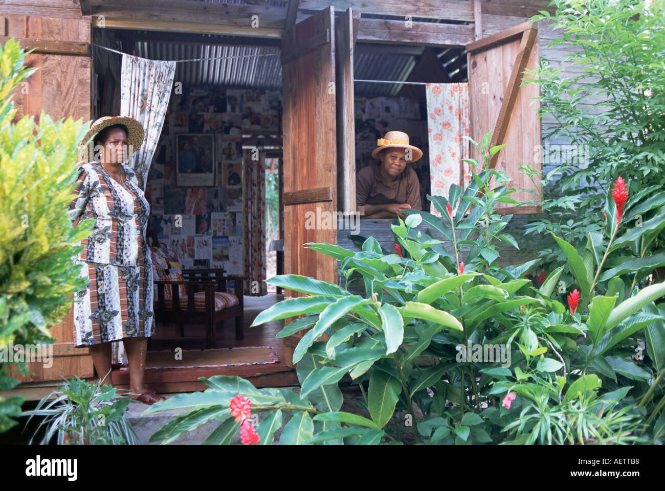 Two women typical Creole house island of Mahe Seychelles Indian Ocean ...