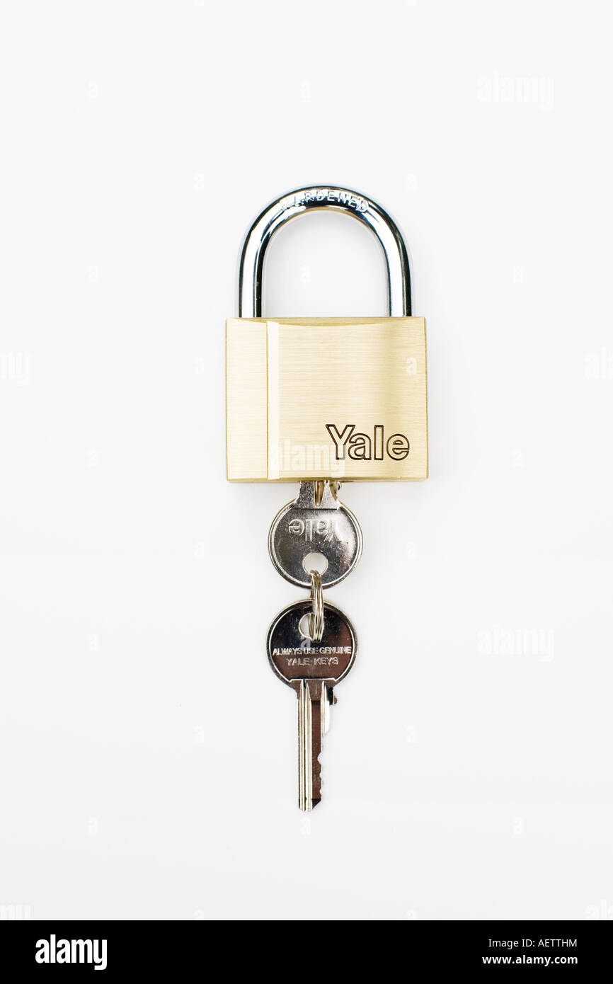 Yale padlock and key against a white background Stock Photo - Alamy