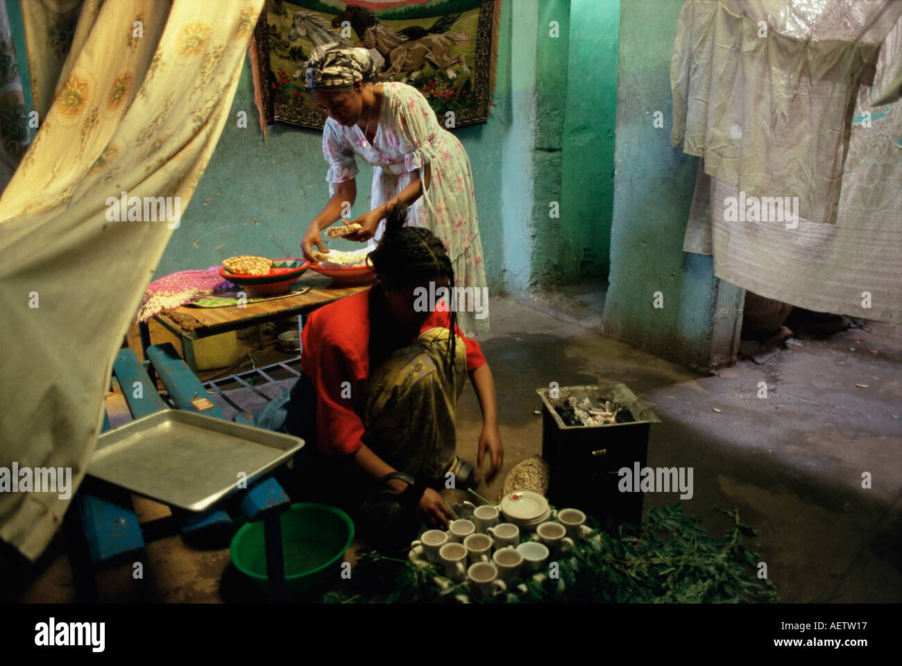 Women preparing food and drink for coffee ceremony Abi Adi village ...