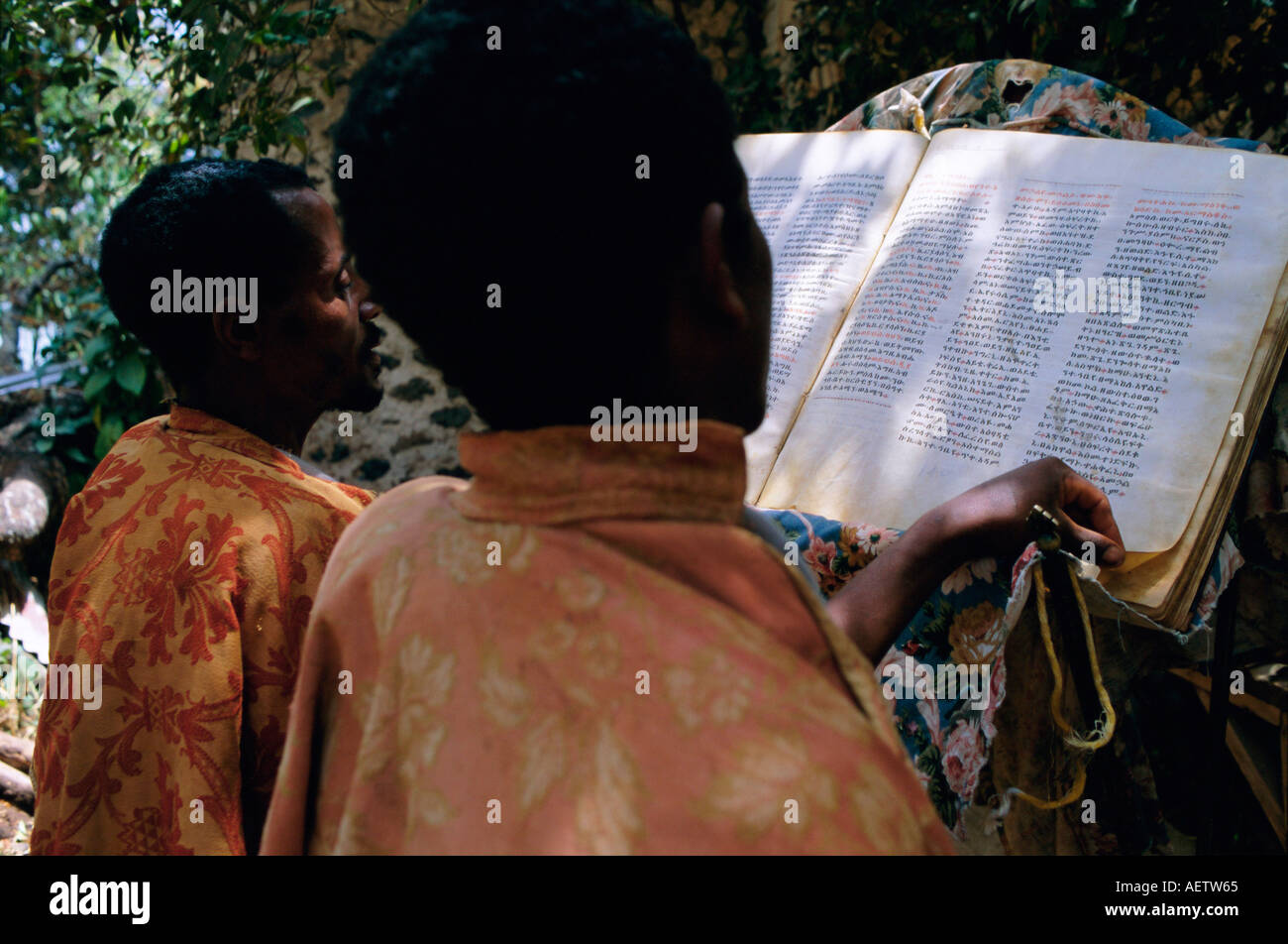 Men with Christian scriptures Narga Selassie church island of Dek Lake ...